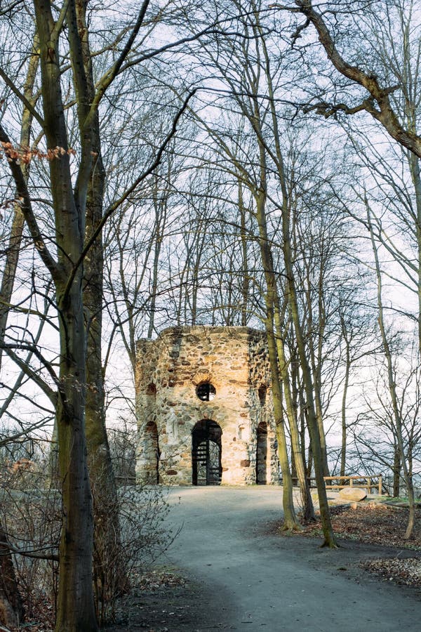 The Ruins of an Ancient Stone Tower Lit by the Setting Sun, Standing in ...