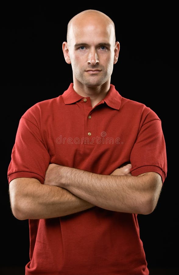 Shot of Serious Bald Man Posing with Arms Crossed Stock Photo - Image ...