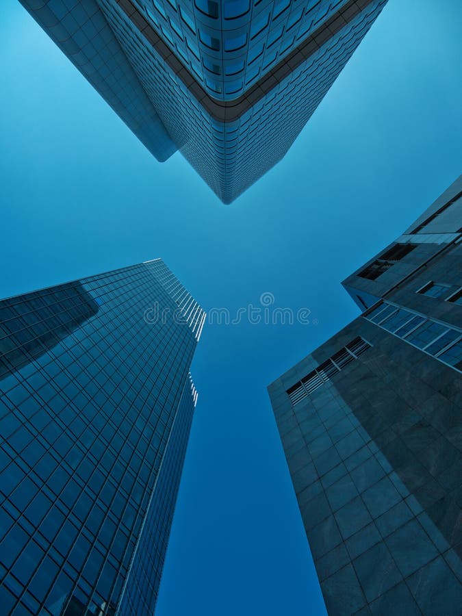 Shot between the Skyscraper Towers Racing through the Sky with Blue Sky ...