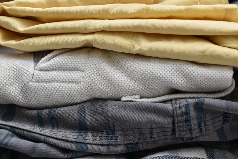 Shot of Stack of Folded Cotton Clothes in Horizontal Frame Stock Photo ...