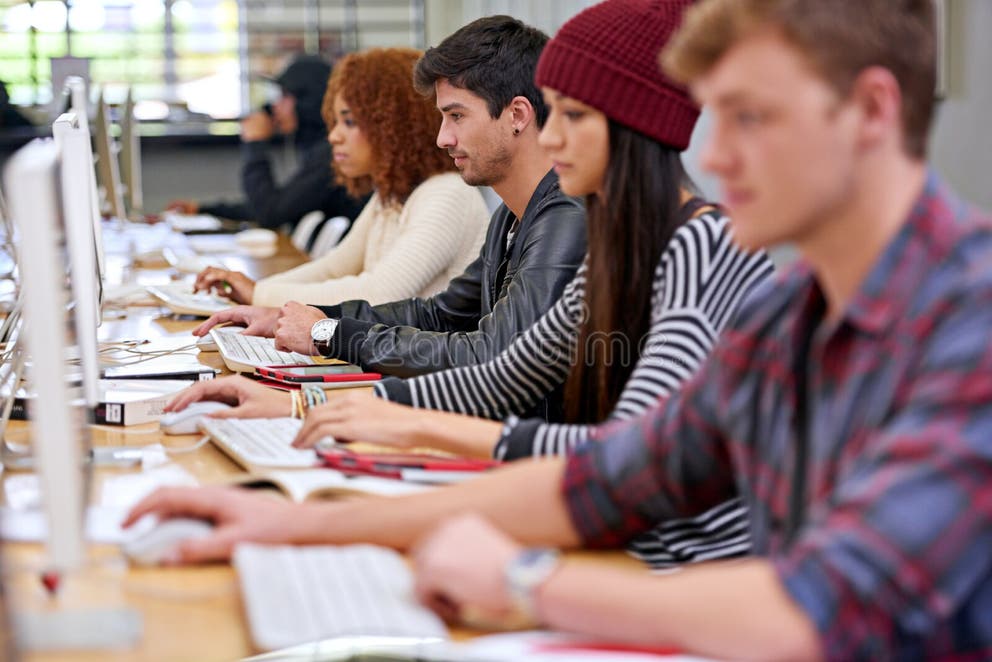Focussed on Their Studies. Shot of Students Working on Computers in a ...