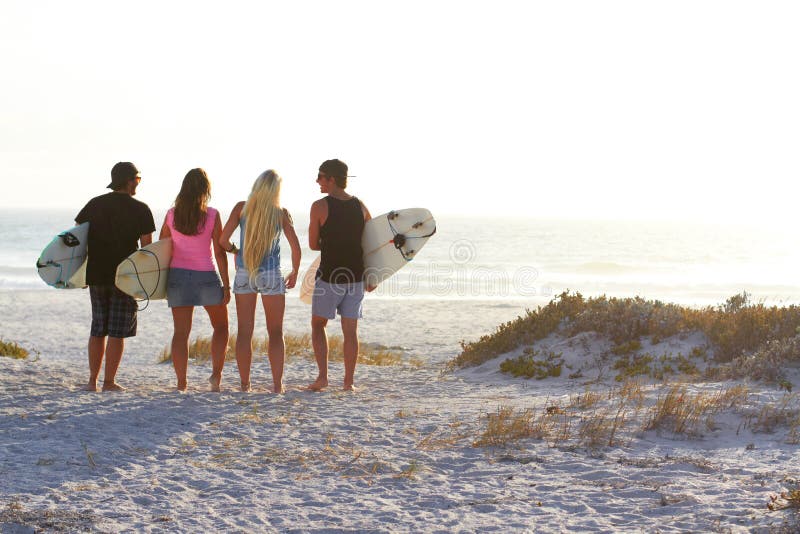 The Perfect Wave is Coming. Shot of Surfing Friends at the Beach. Stock ...