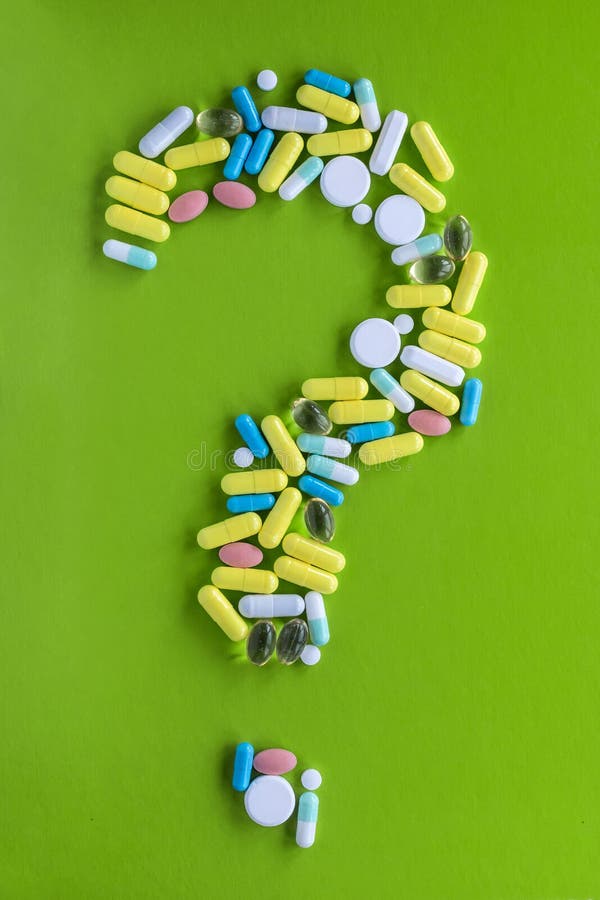 Symbol Question Mark from Colored Tablets and Capsules on Green ...