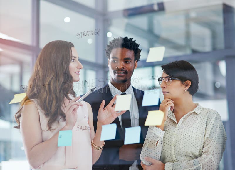 Go Getters Get Things Done. Shot of a Team of Professionals Having a ...