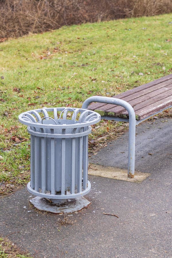 Shot of the Trash Bin by the Bench in the Park. Outdoor Stock Photo ...