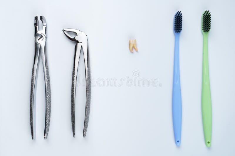 Shot of Two Dental Tools with Tooth on Isolated White Background Stock ...