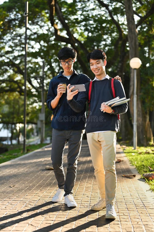 Shot of Two Friendly Students are Talking To Each Other after Classes ...