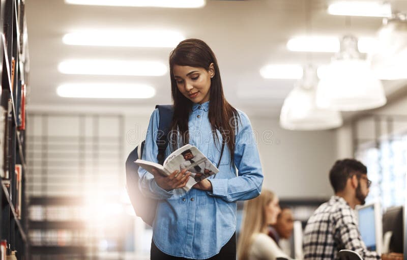 Student, Book and Woman Reading in a Library at University, College or ...
