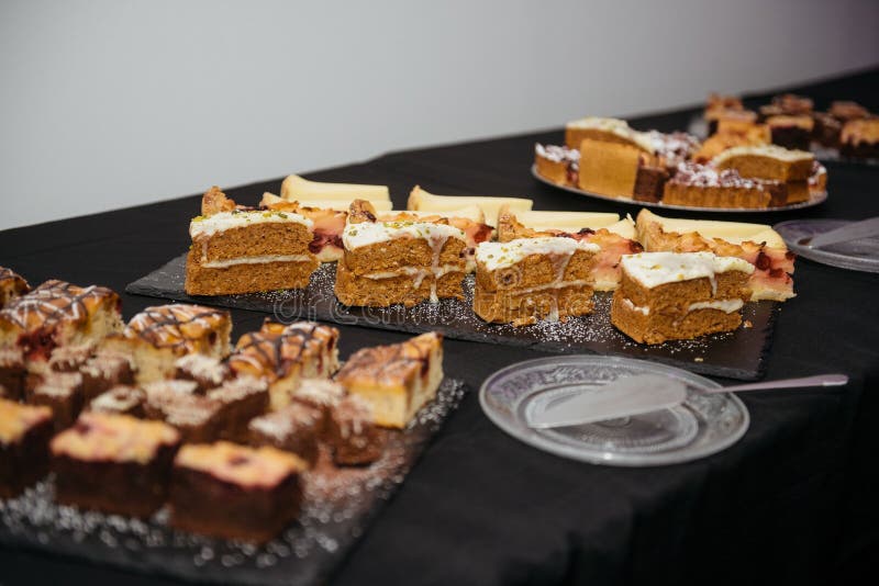 Shot of Various Slices of Cake and Desserts are Arranged on Platters on ...