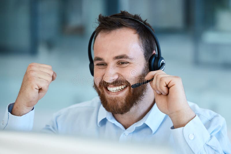 Shot of a Young Call Centre Agent Cheering while Working on a Computer ...