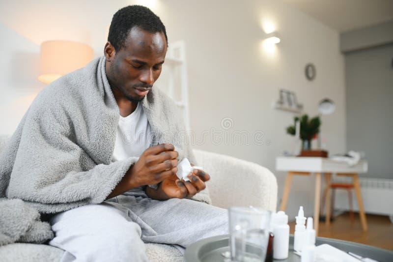 Shot of a Young Man with a Cold Recuperating at Home Stock Image ...