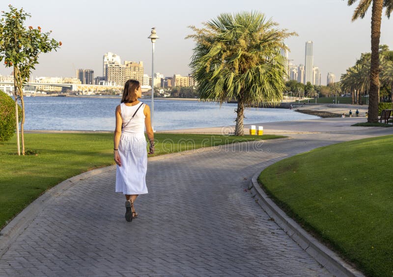 Shot of the Young Woman Walking in the Park. Outdoors Editorial Stock ...