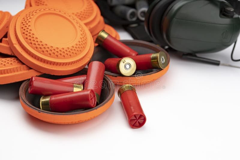 Shotgun Bullets and Clay Disc Flying Target on White Background Stock ...