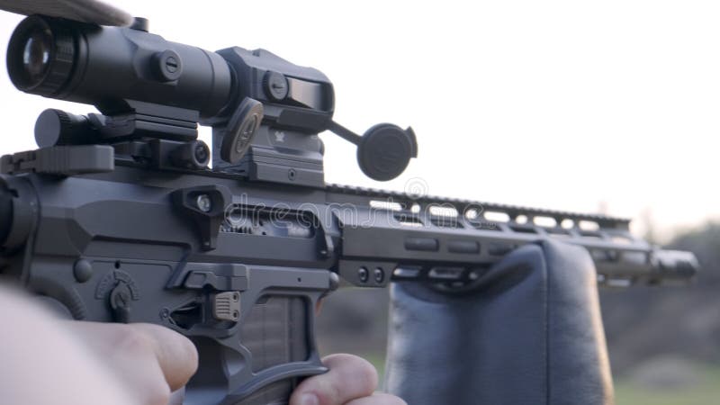 Shotgun in Man` S Hand. Front Side of Weapon with Close Up View on ...