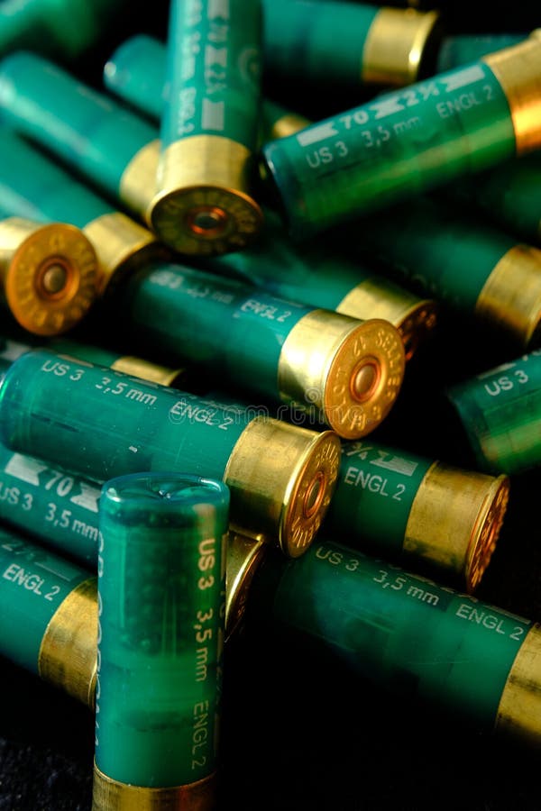 Shotgun Shells on a Black Surface. Ammunition for 12 Gauge Smoothbore ...