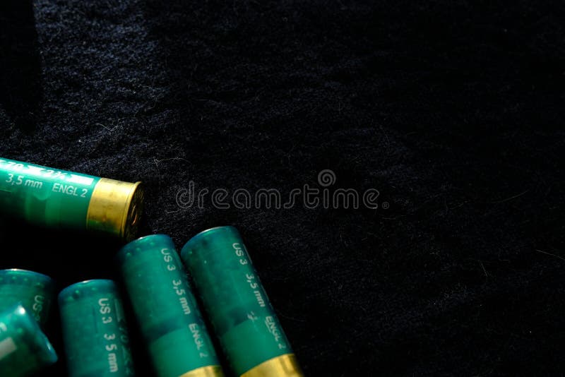 Shotgun Shells on a Black Surface. Ammunition for 12 Gauge Smoothbore ...