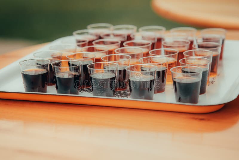 Shots or Appetizers in Plastic Glasses on a Table at a Party or Wedding ...