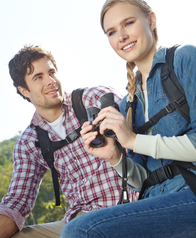 Should we Get Back on the Trail. a Young Couple Atop a Mountain while ...