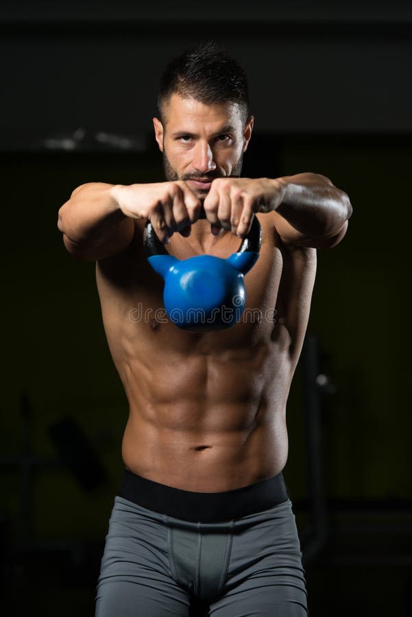 Shoulder Exercise with Kettle-bell in a Gym Stock Image - Image of ...