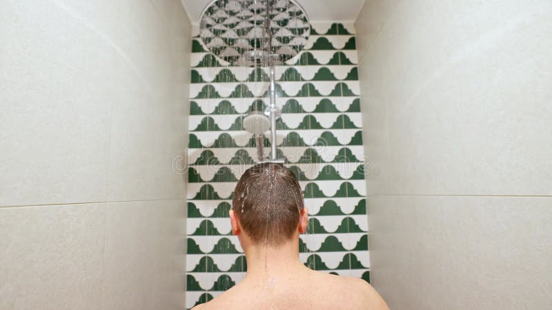 Shoulder-high Rear View of a Man Taking a Shower. Stock Footage - Video ...