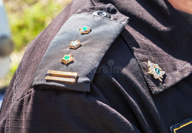 Shoulder Straps With Insignia On The Bailiff`s Uniform. Selective Focus ...