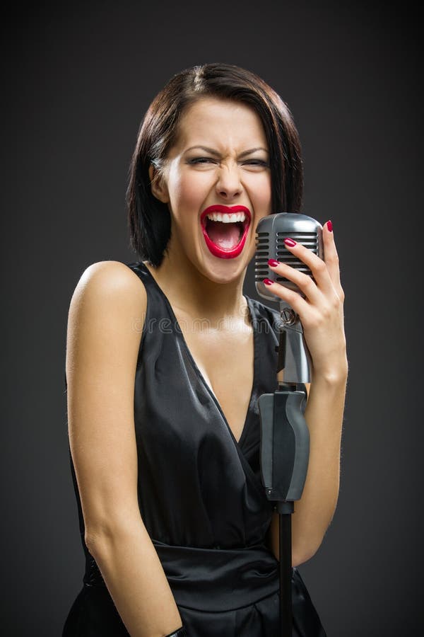 Shouting Female Singer Keeping Microphone Stock Photos - Free & Royalty ...
