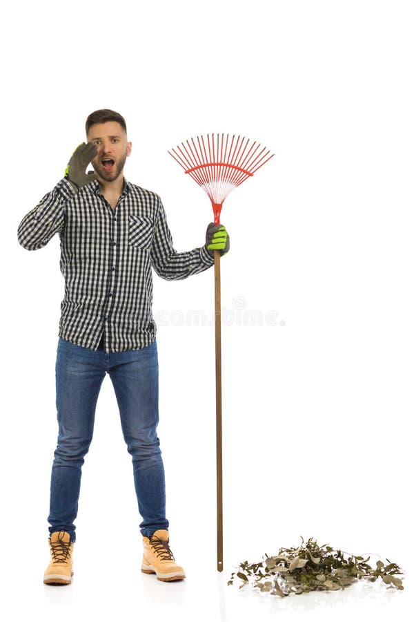 Handsome Smiling Man is Standing with a Leaf Rake. Full Length Studio ...