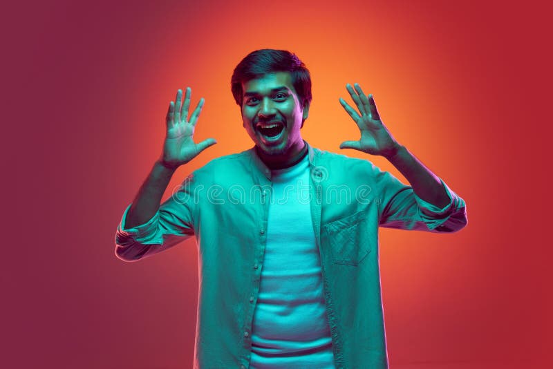 Shouting of Joy Young Indian Man Raising Hand of Excitement in Neon ...