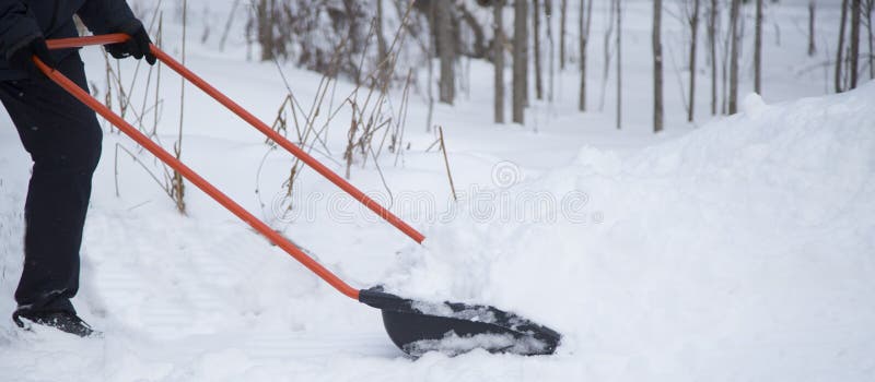 A Shovel for Cleaning Snow. Snow Removal in Winter during Snowfall ...