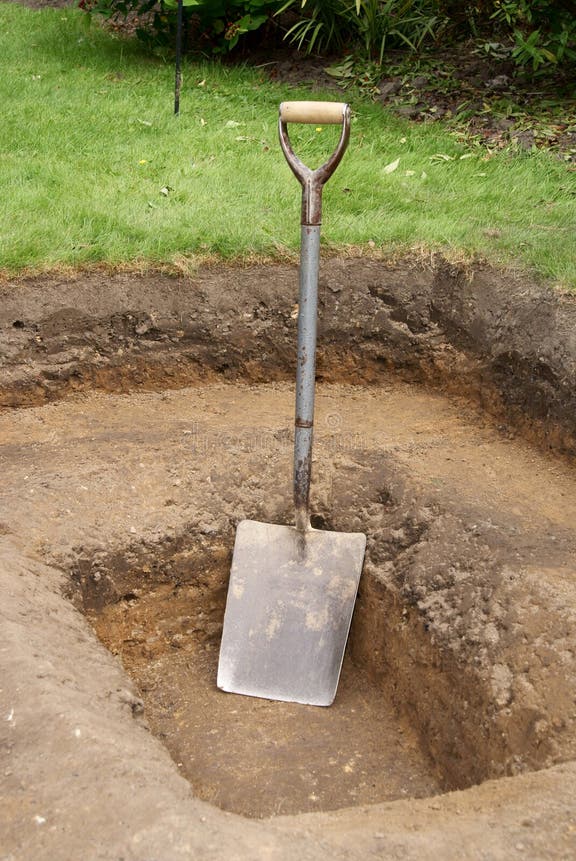 Shovel in hole for pond stock photo. Image of garden - 15932266