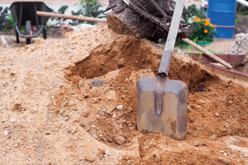 Shovel in sand stock photo. Image of construction, sand - 33574954