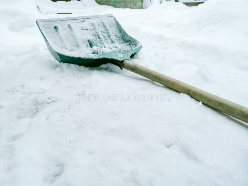 The Shovel for Snow Removal is Lying Down. Snow Removal in the Yard in ...