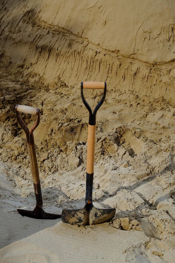 Shovels in the sand stock image. Image of snow, background - 97361797