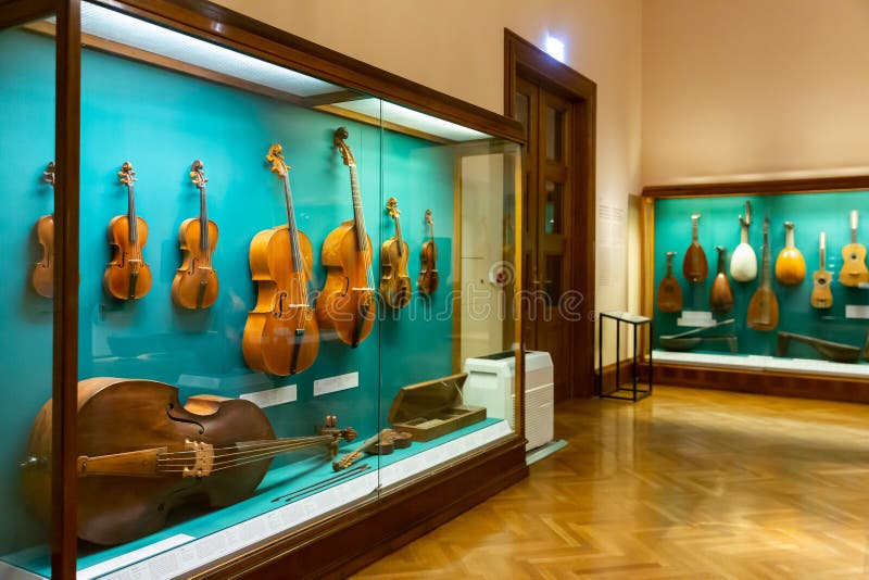 Showcase with Bowed String Instruments in Weltmuseum Wien, Austria ...