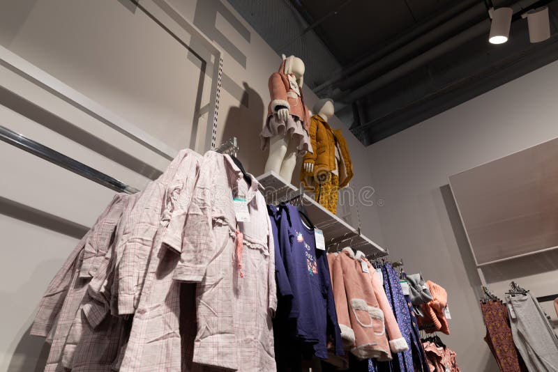 Showcase with Clothes in a Store Clothes for Children and Adults Stock ...