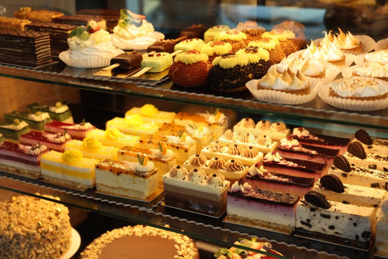 Showcase with Different Tasty Desserts in Bakery Shop, Closeup Stock ...
