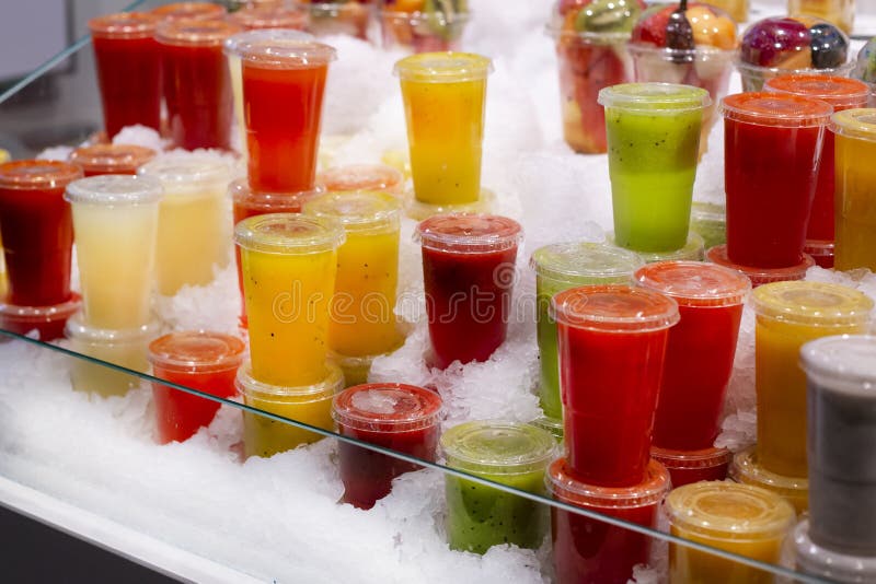 Showcase with Different Types of Colorful Cold Juice and Smoothie in ...
