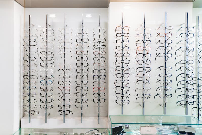 Showcase with Glasses in Different Frames in the Optics Store ...
