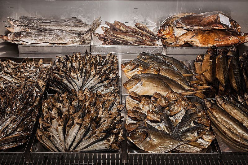 Showcase with smoked fish stock photo. Image of body - 95578492