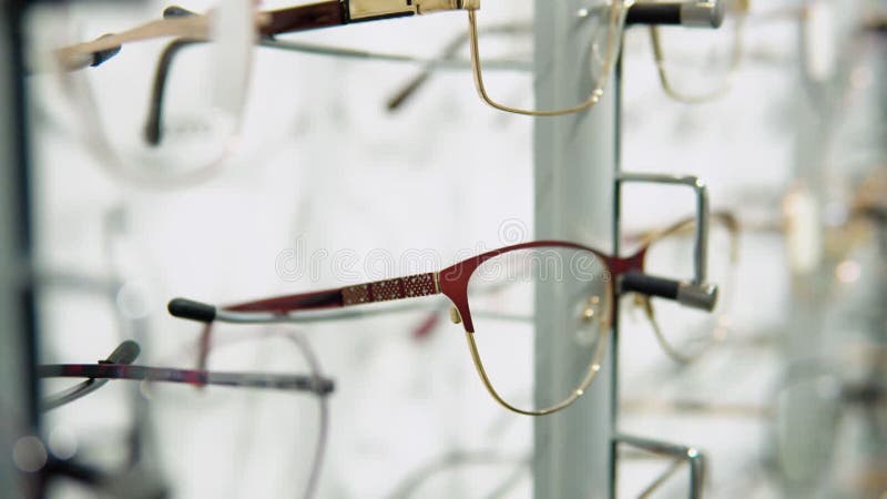Showcase with Spectacles in Modern Ophthalmic Store. Glasses on Display ...