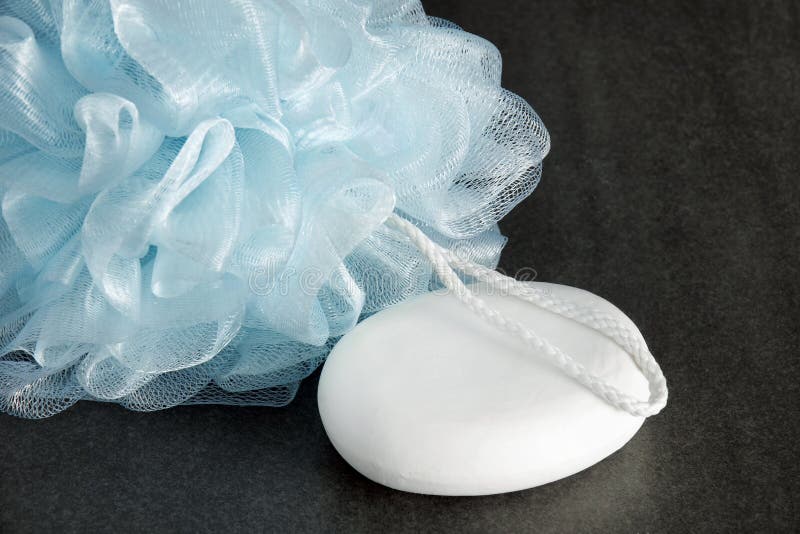 Shower Puff and Soap on Dark Tile Stock Photo - Image of soap, ceramic ...
