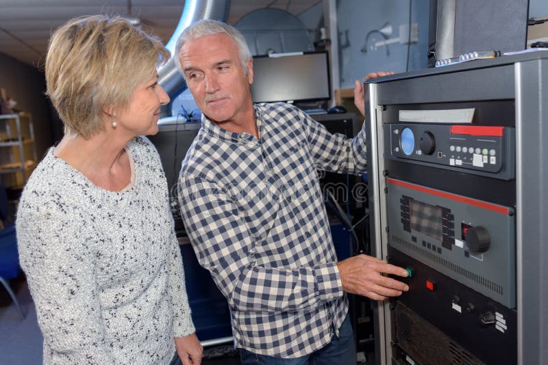 They Showing Complex Machine Stock Image - Image of woman, male: 202174991