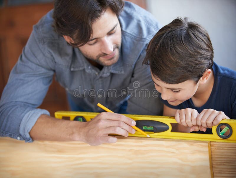Showing Him How To Do DIY Work. a Father and Son Doing Woodwork ...