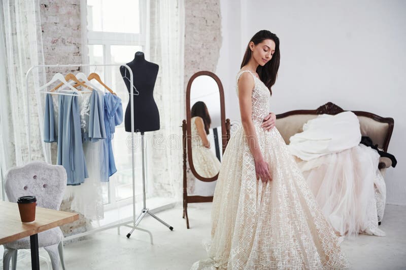 Showing Side. the Process of Fitting the Dress in the Studio of Hand ...