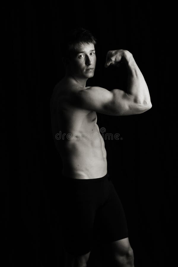Showing some muscle stock image. Image of posing, bodybuilder - 17908719