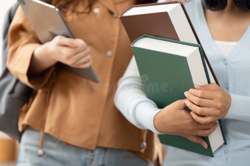 Study Essentials and Learning Tools. Two Friends Holding Books and ...