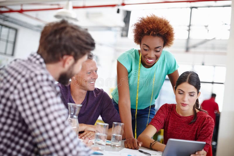 Showing Them Some Of Her Ideas A Group Of Coworkers In A Meeting
