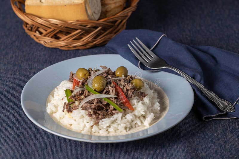 Shredded Meat with Rice, Typical Cuban Food on Blue Tablecloth Stock ...