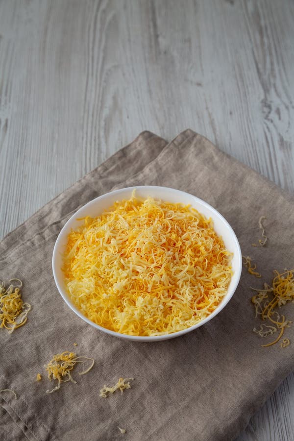 Shredded Mexican Cheese Mix in a White Bowl, Side View. Space for Text ...