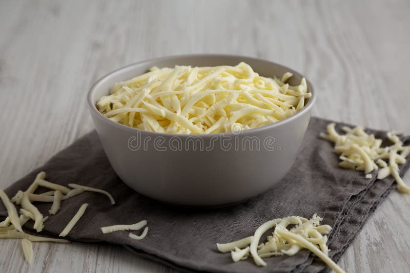 Shredded Mozzarella Cheese in a Bowl, Side View Stock Image - Image of ...